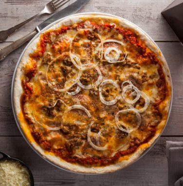 Receta de pizza de anchoas, la pizza puttanesca - Unareceta.com